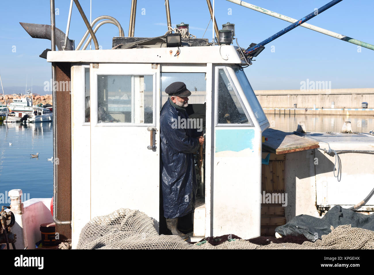 driving a fishing boat Stock Photo - Alamy