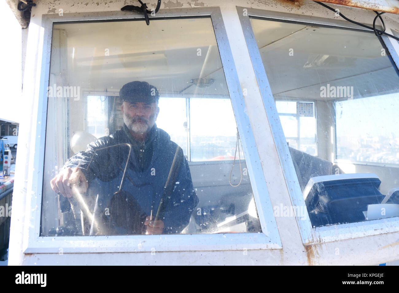 driving a fishing boat Stock Photo - Alamy