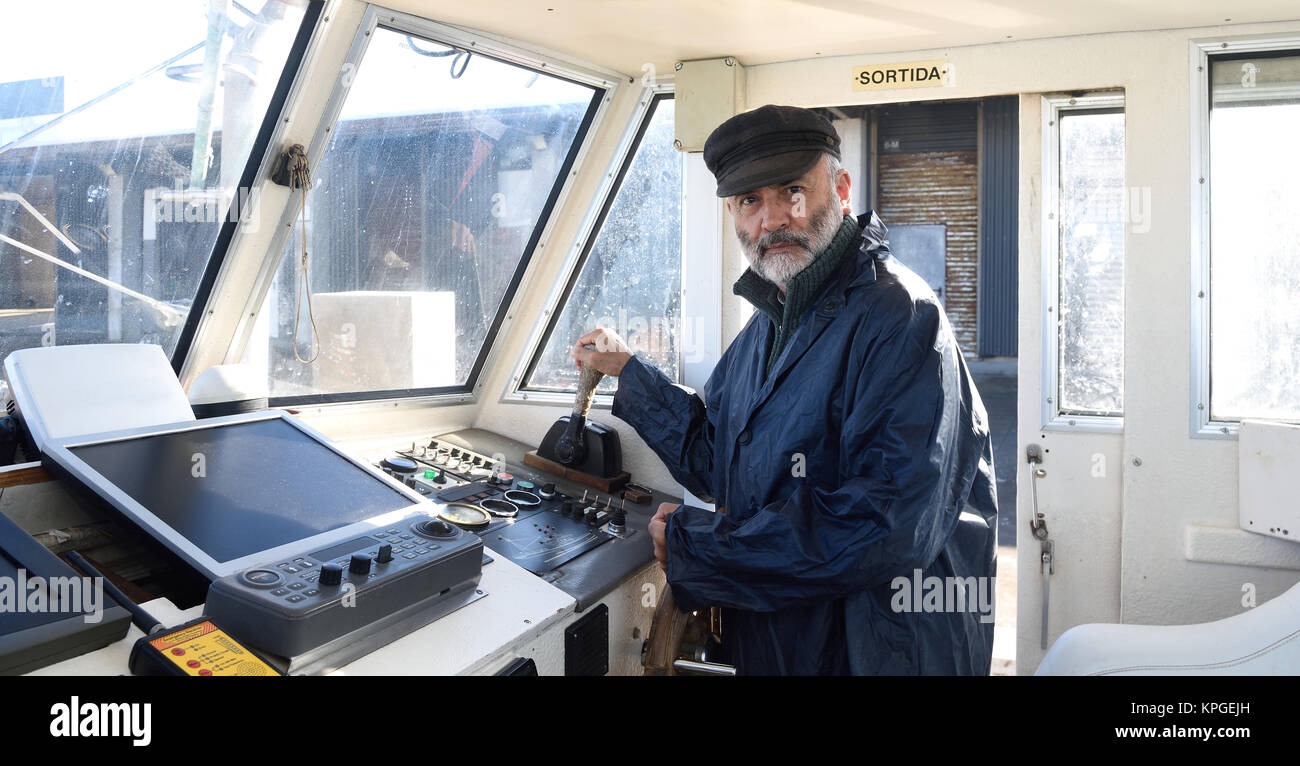 driving a fishing boat Stock Photo - Alamy