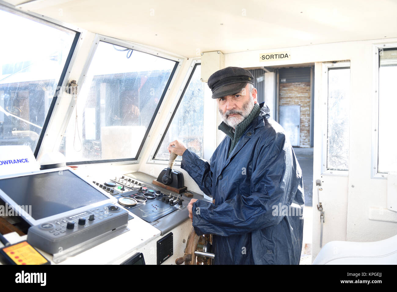 driving a fishing boat Stock Photo - Alamy