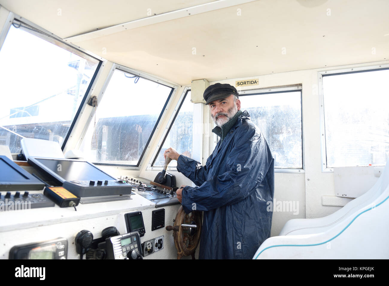 driving a fishing boat Stock Photo - Alamy