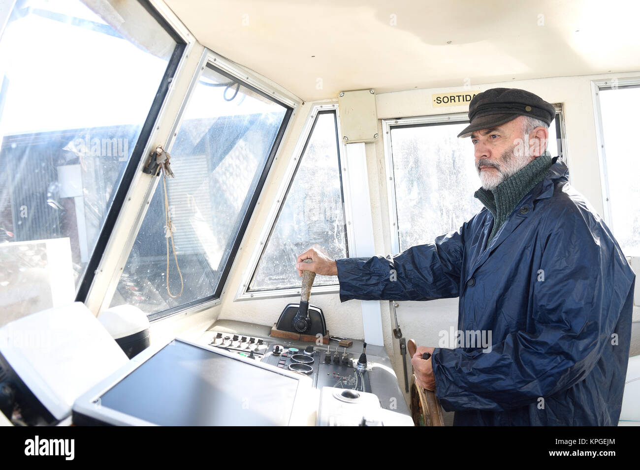 driving a fishing boat Stock Photo - Alamy