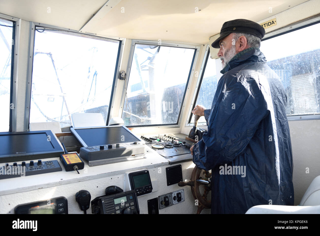 driving a fishing boat Stock Photo - Alamy
