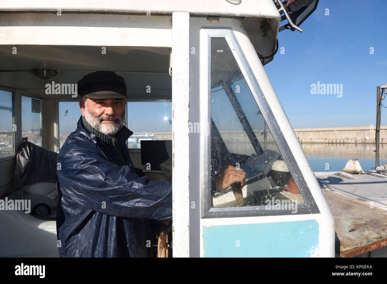 driving a fishing boat Stock Photo - Alamy