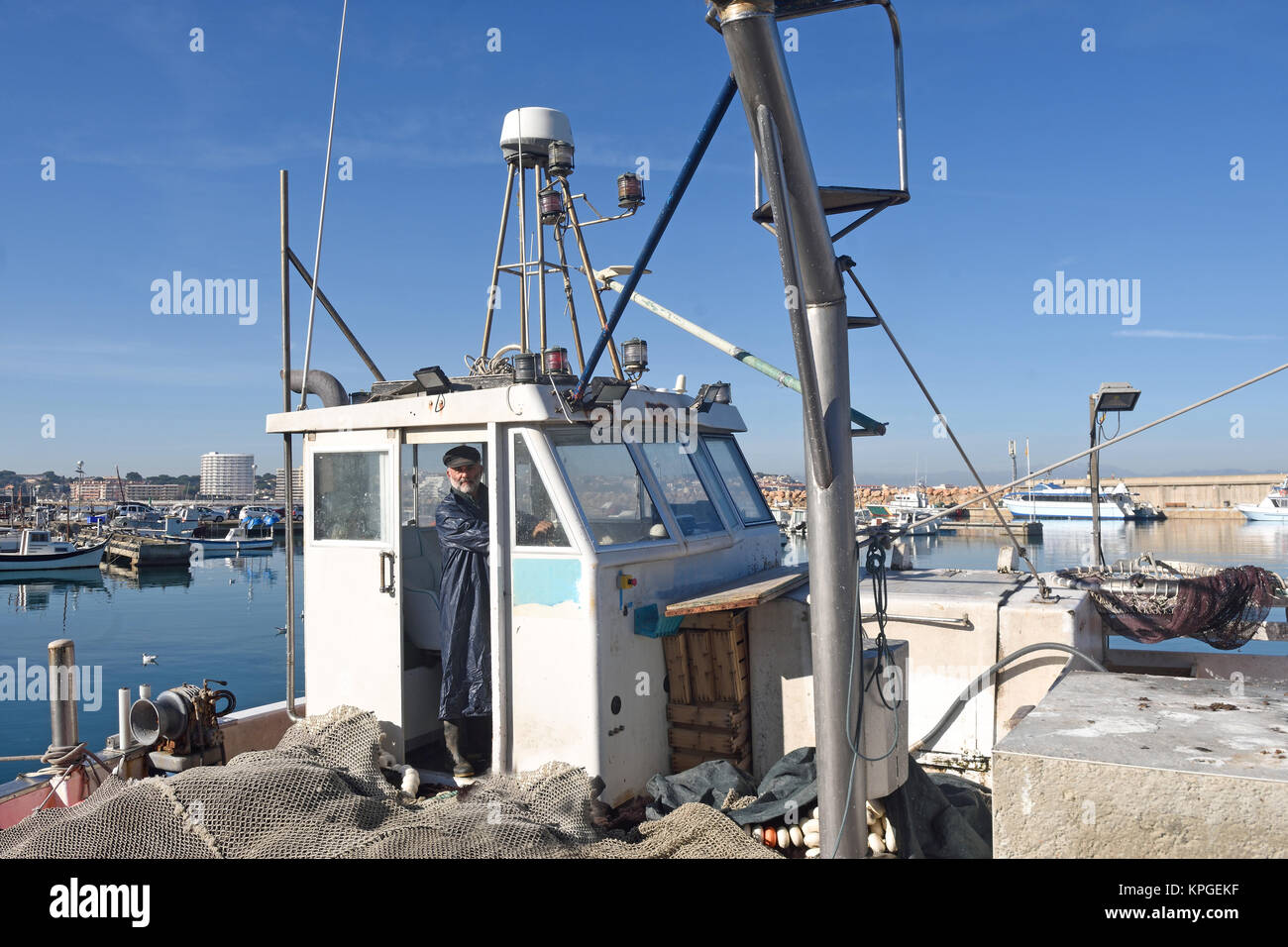 driving a fishing boat Stock Photo - Alamy