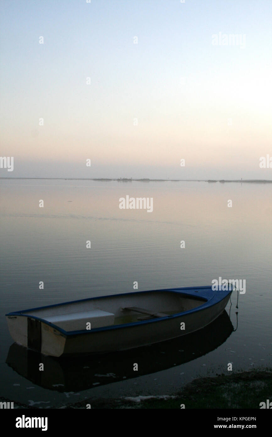 Small rowing boat next to the bank on the lagoon, Hermanus, South ...