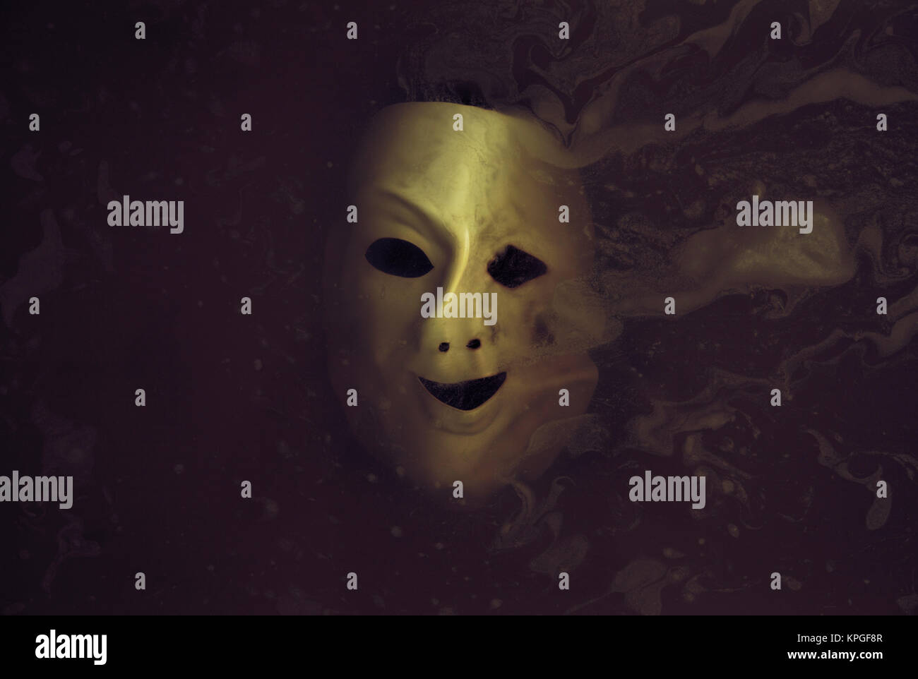 Deformed scary mask in the dark water Stock Photo - Alamy