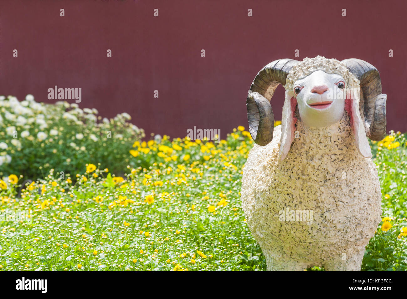 Sculpture sheep with a floral background Stock Photo - Alamy