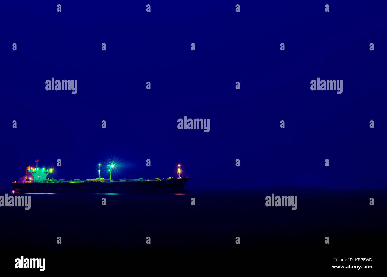 alone boat,Sea cargo ship at night Stock Photo - Alamy
