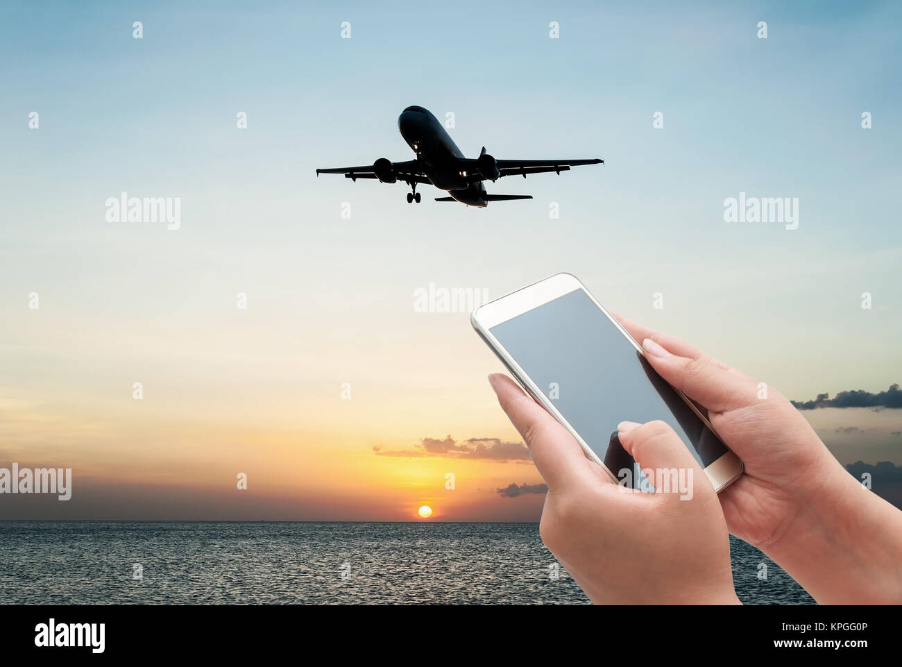 The women using smartphone on plane airline Stock Photo - Alamy