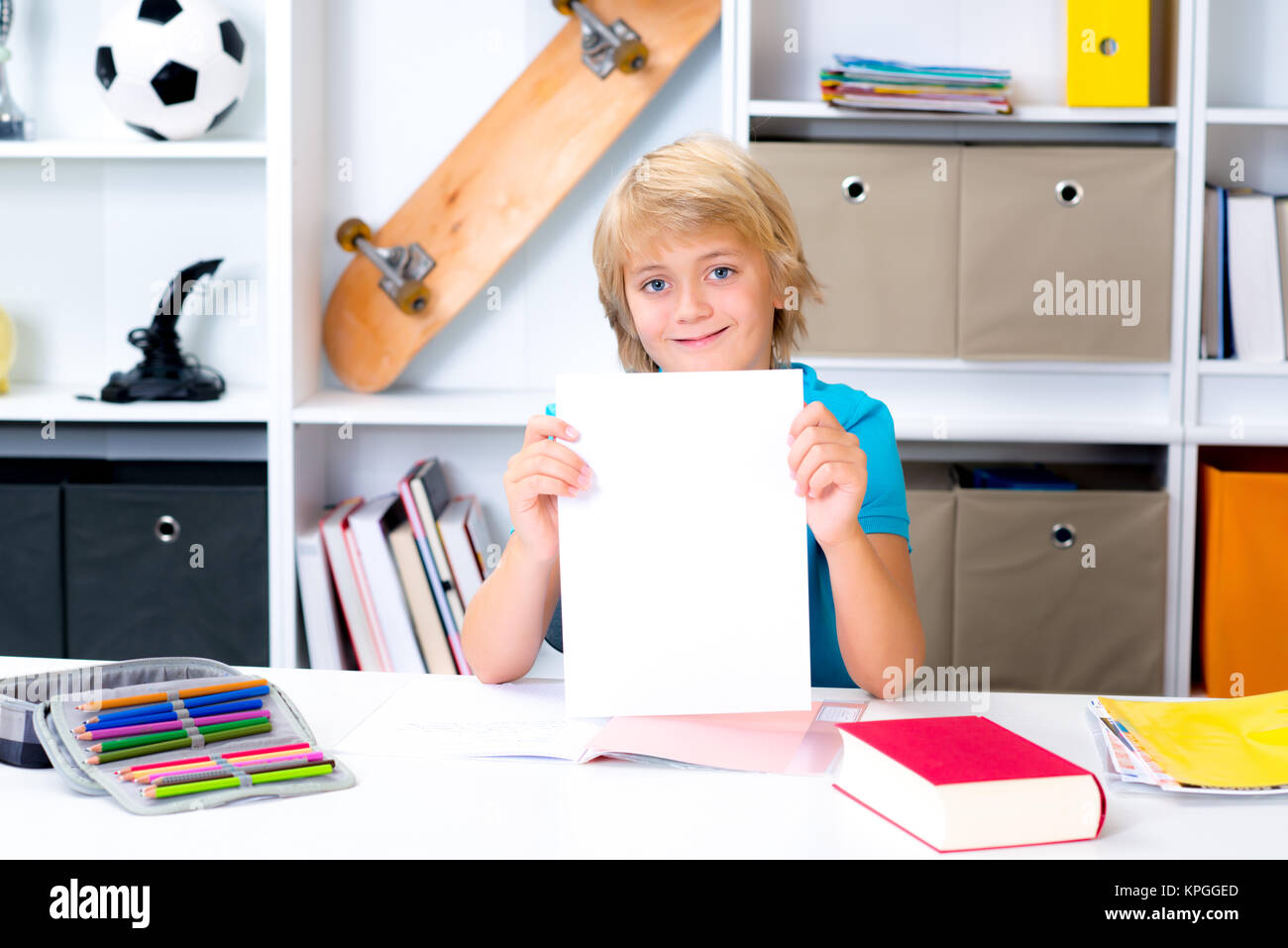 blond boy on desk with good report card Stock Photo - Alamy