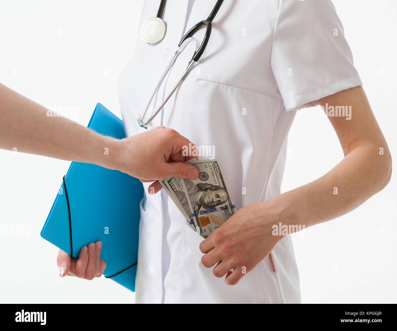 Patient's hand giving a bribe doctor Stock Photo - Alamy