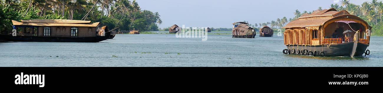 Asia, India, Kerala (Backwaters). Houseboats float along a Kerala ...
