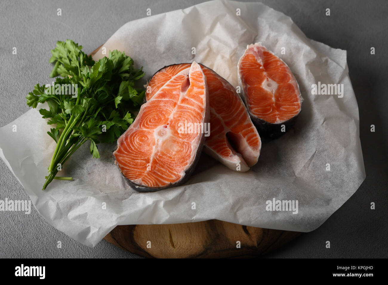 Raw fish salmon steaks with greens, food closeup Stock Photo - Alamy