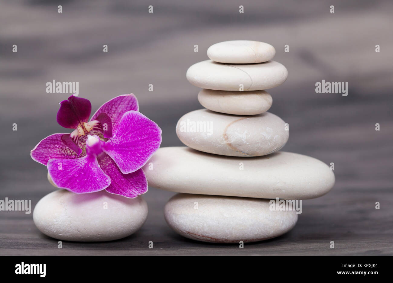 White spa stones and oriental flower Stock Photo - Alamy
