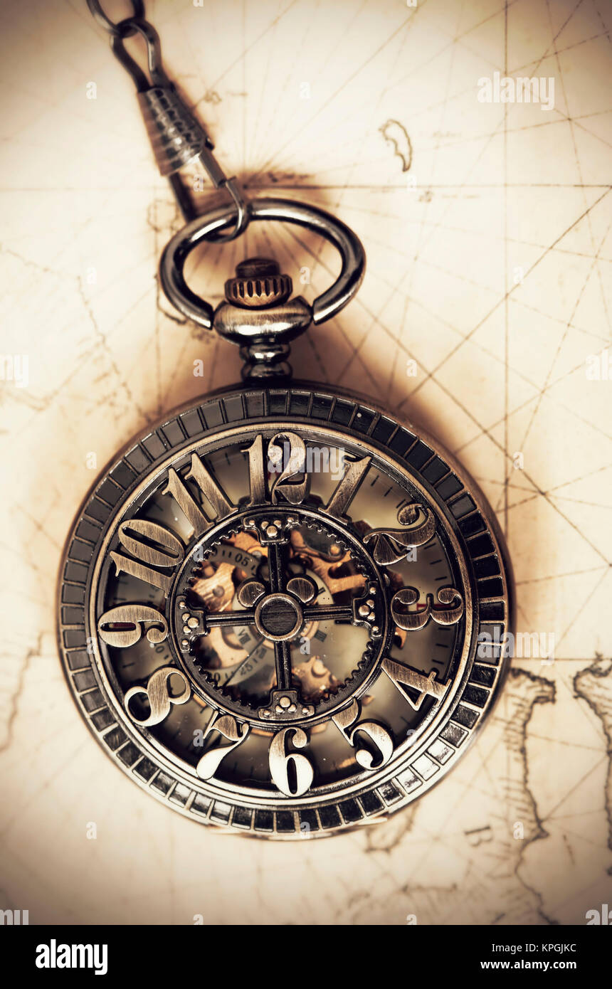 Vintage pocket watch on old map Stock Photo - Alamy
