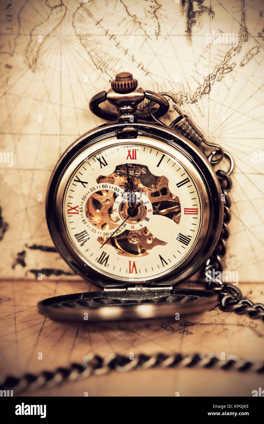 Vintage pocket watch on old map Stock Photo - Alamy