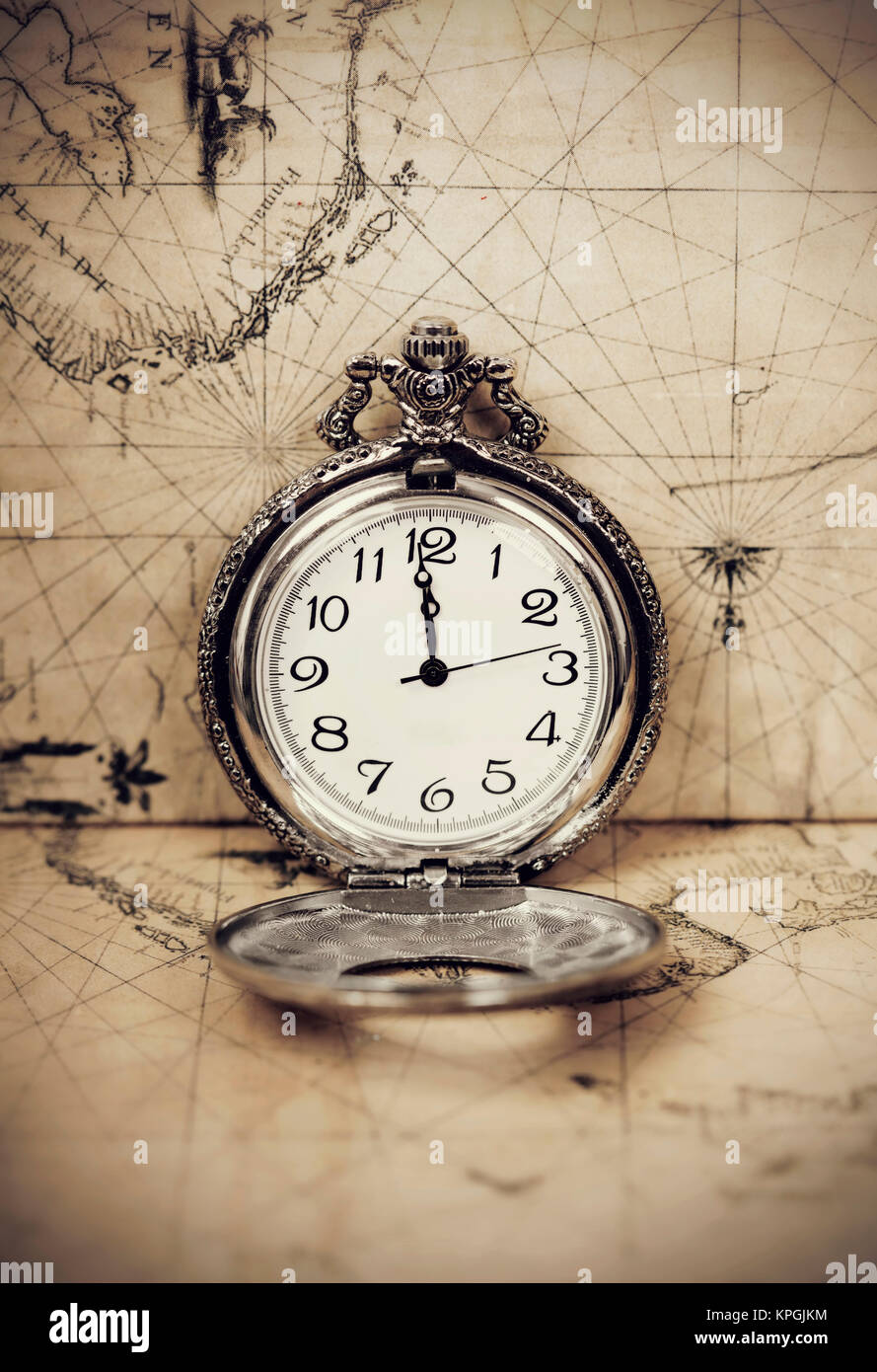 Vintage pocket watch on old map Stock Photo - Alamy