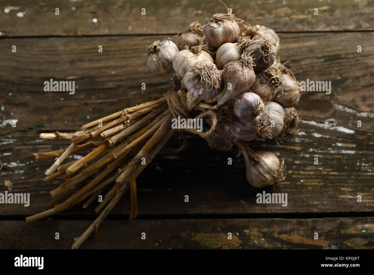Bunch of garlic on boards, food above Stock Photo - Alamy