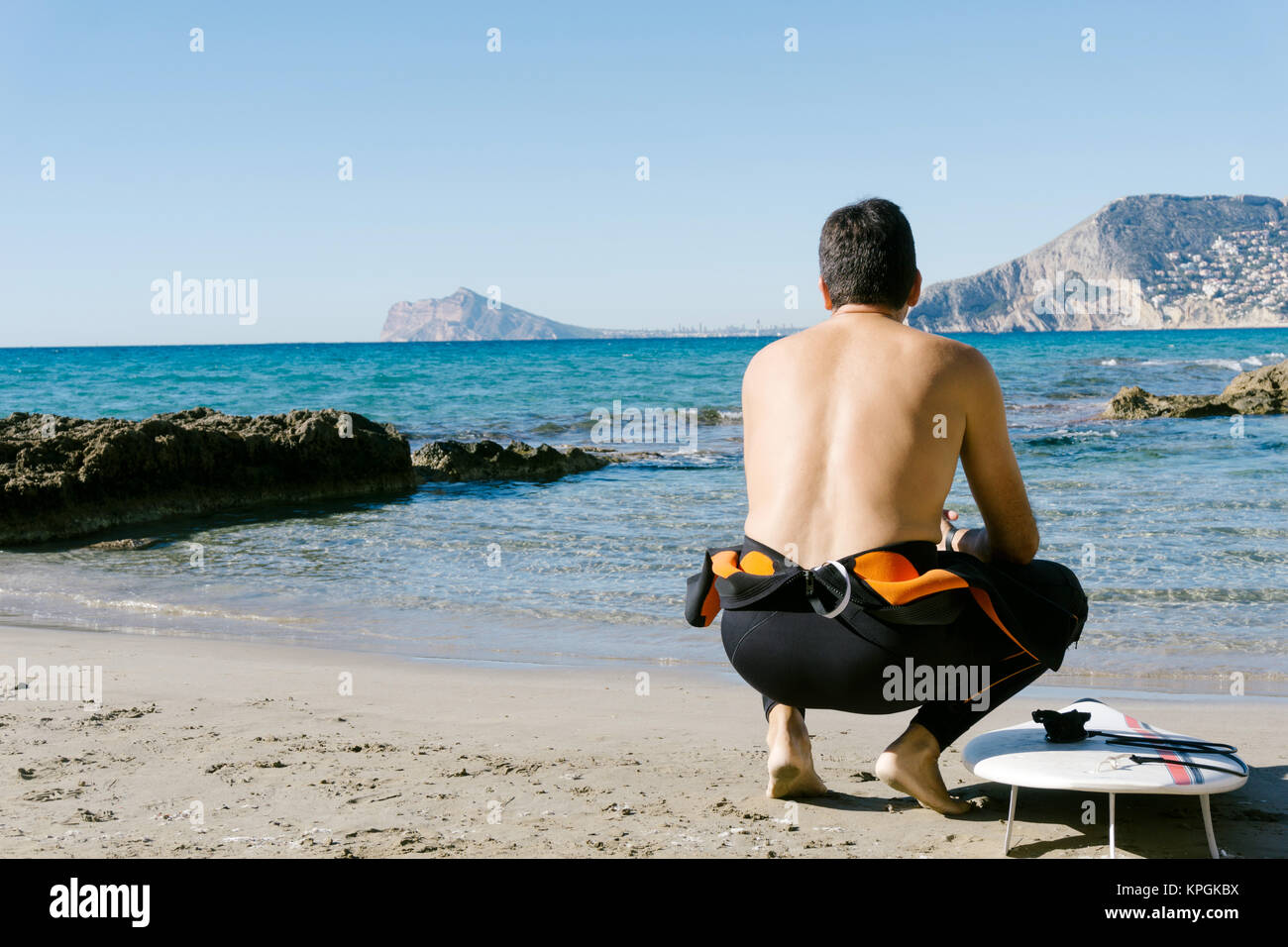 Squatting man hi-res stock photography and images - Alamy