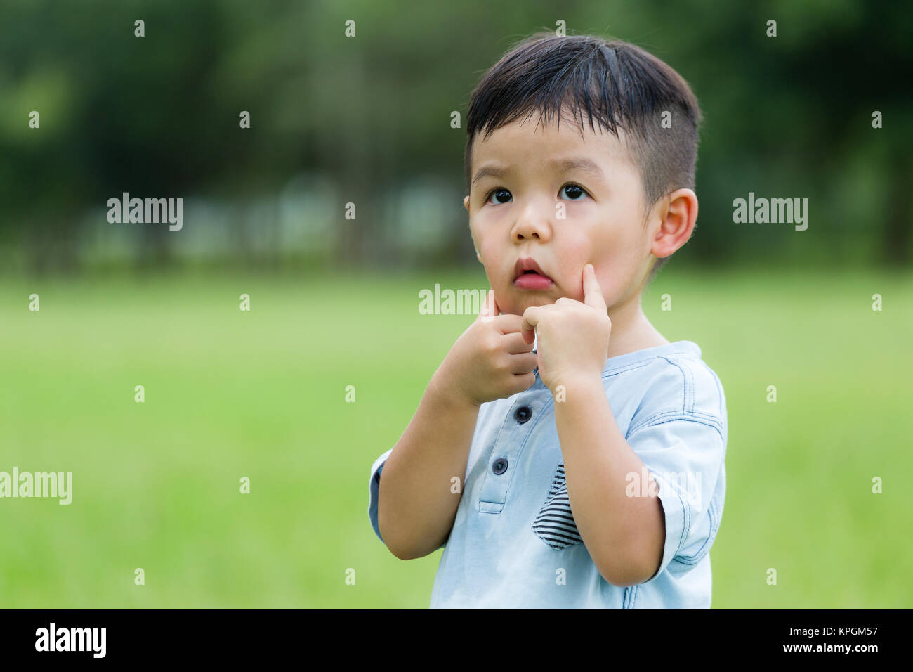 Little boy make a cute face Stock Photo - Alamy