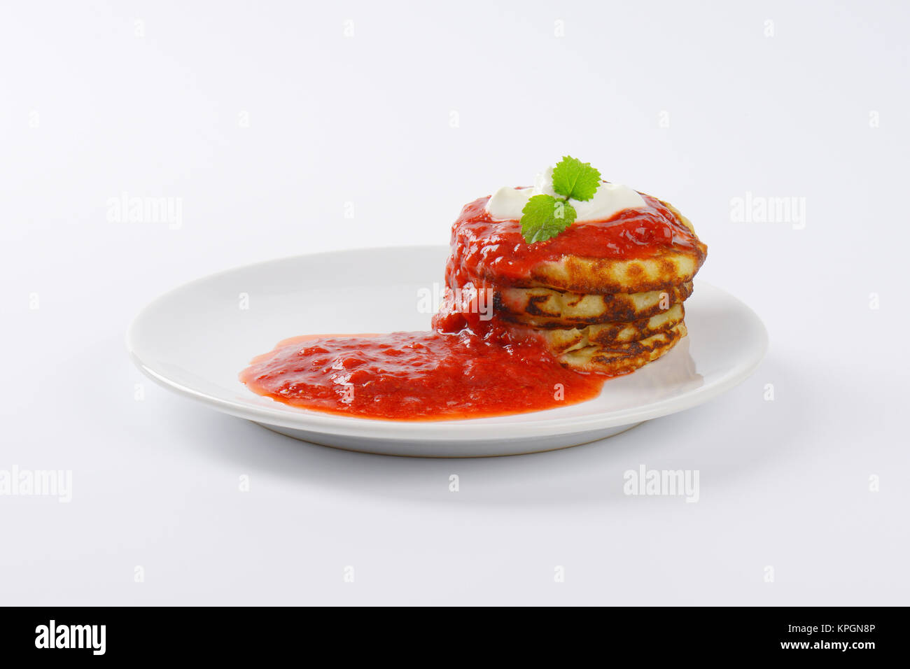 pancakes with strawberry puree Stock Photo - Alamy