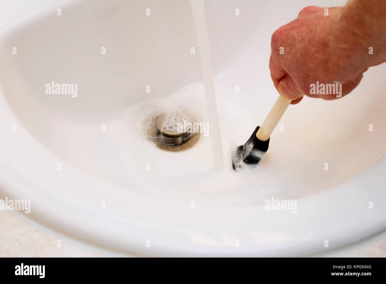 Hand of a Man Cleaning Paint from a Paintbrush Stock Photo - Alamy