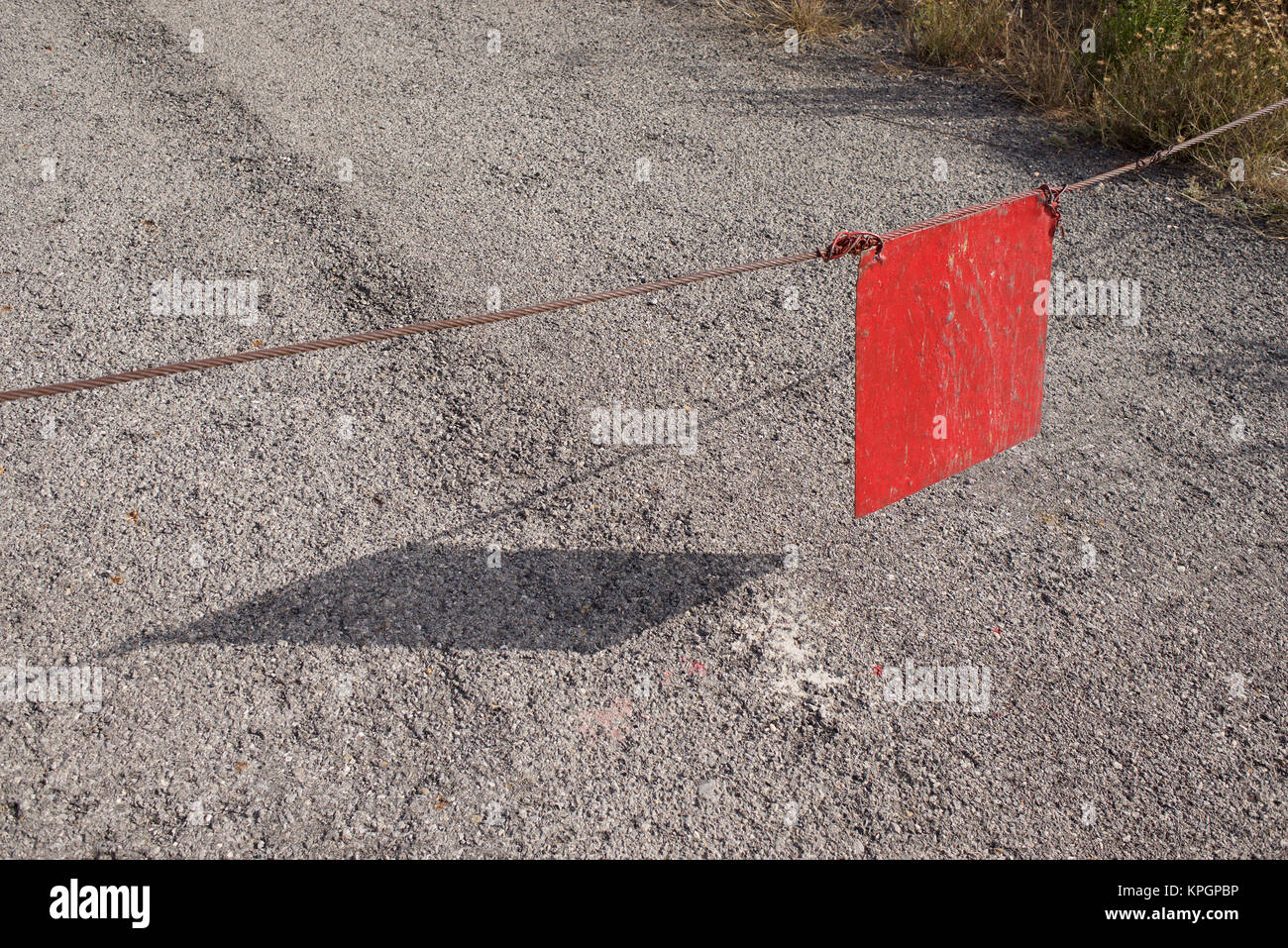 Detail of a red symbol on a chain Stock Photo - Alamy
