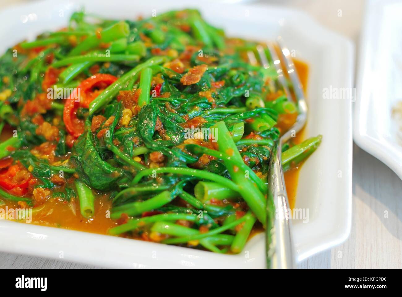 Sumptuous, Chinese style kang kong vegetables cooked with hot, spicy ...