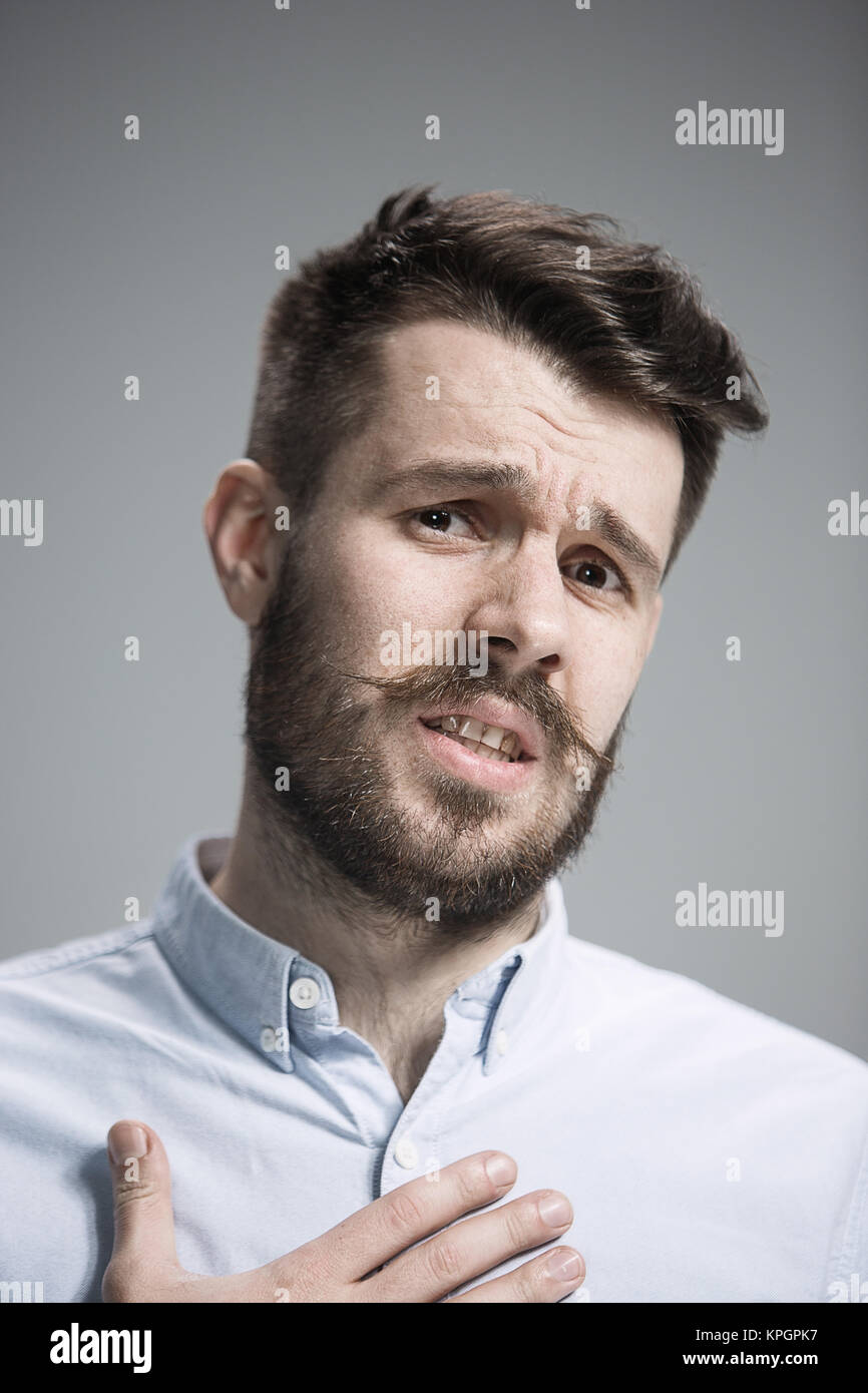 Close up face of discouraged man Stock Photo - Alamy