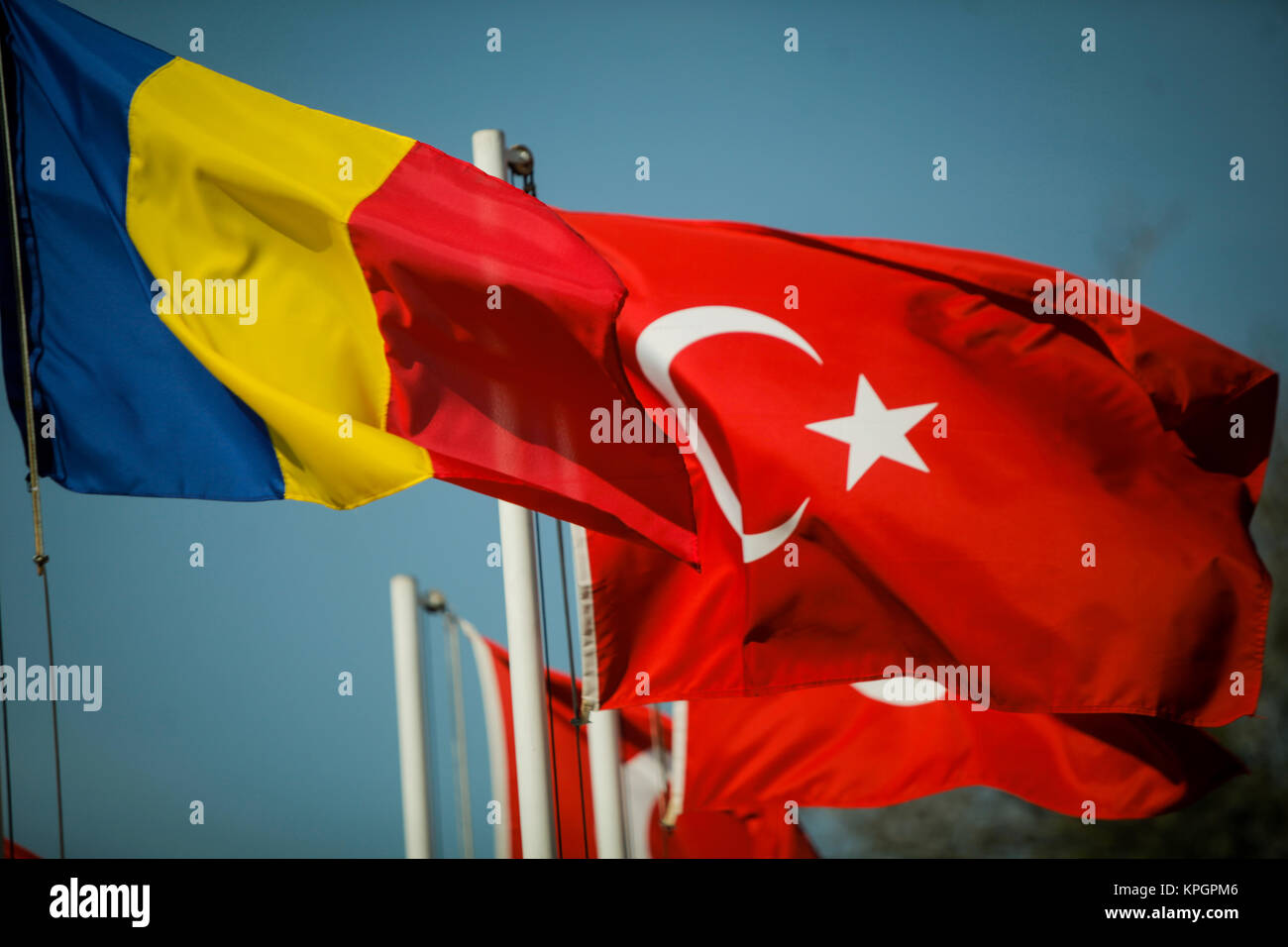 Romania and Turkey national flags wave together in the wind Stock Photo ...
