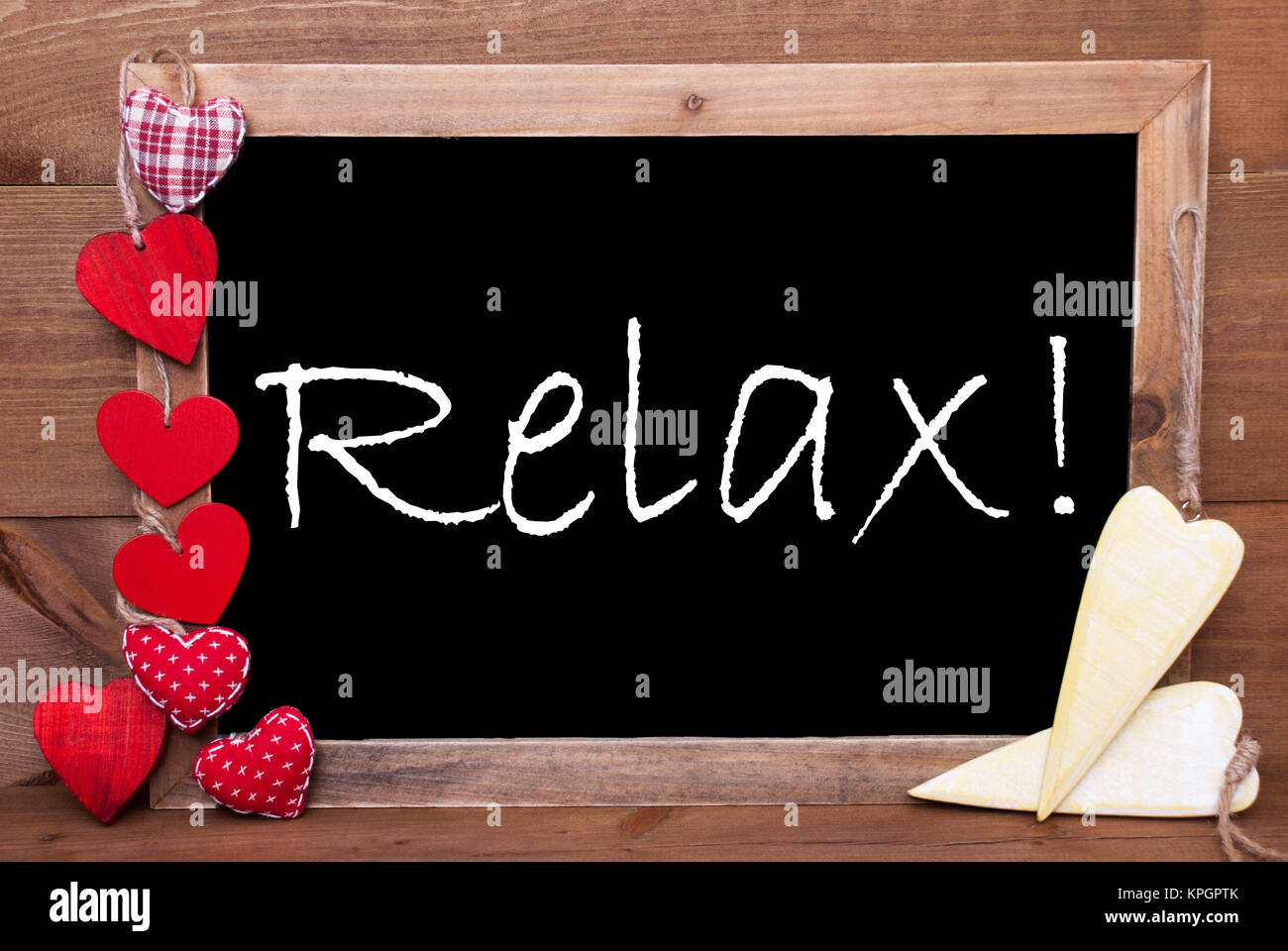 Chalkboard With English Text Relax. Many Red Textile And Wooden Yellow ...