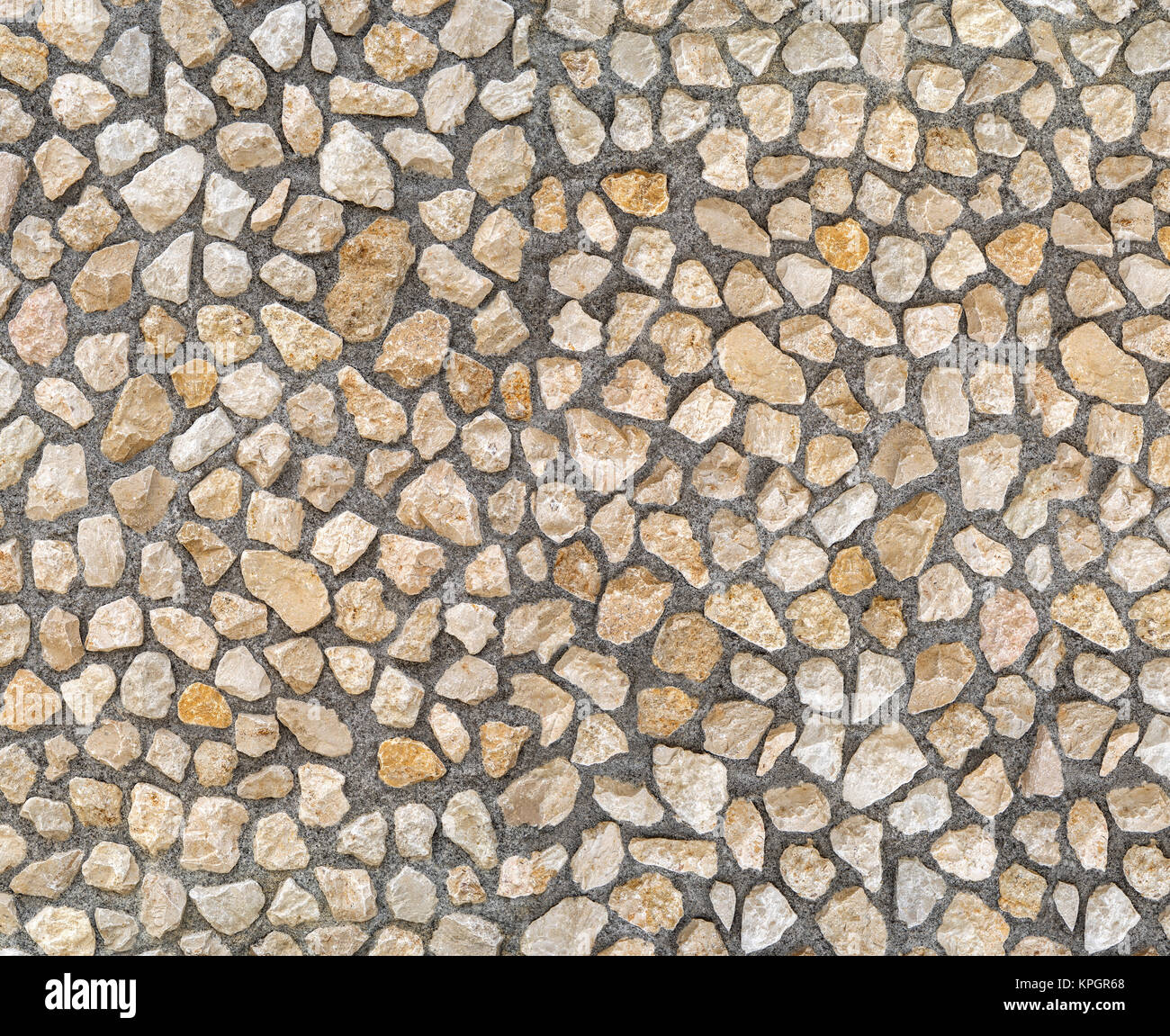 Bright stone wall of coarse,amimature and brown natural stones Stock ...