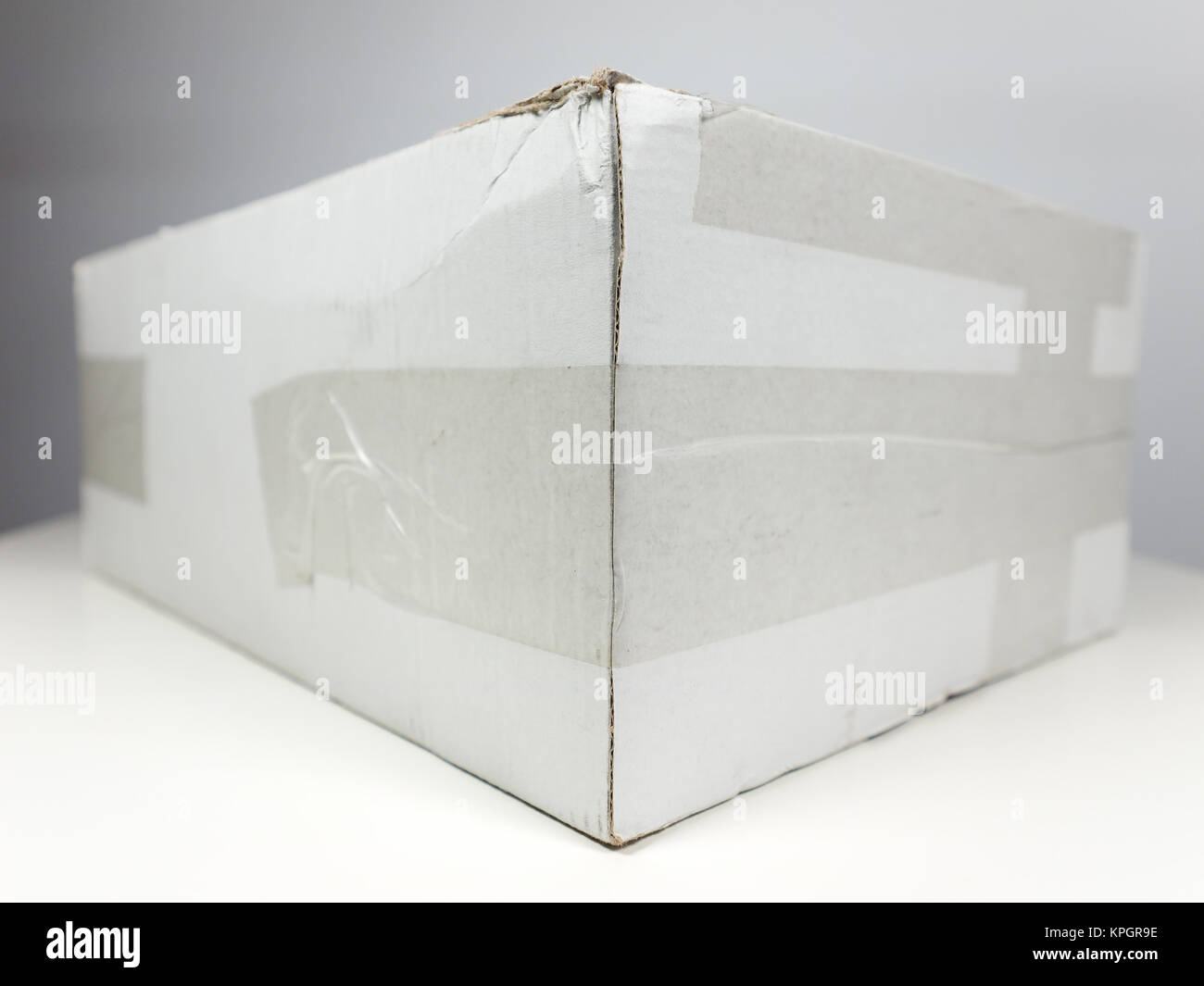 White packet parcel Stock Photo - Alamy