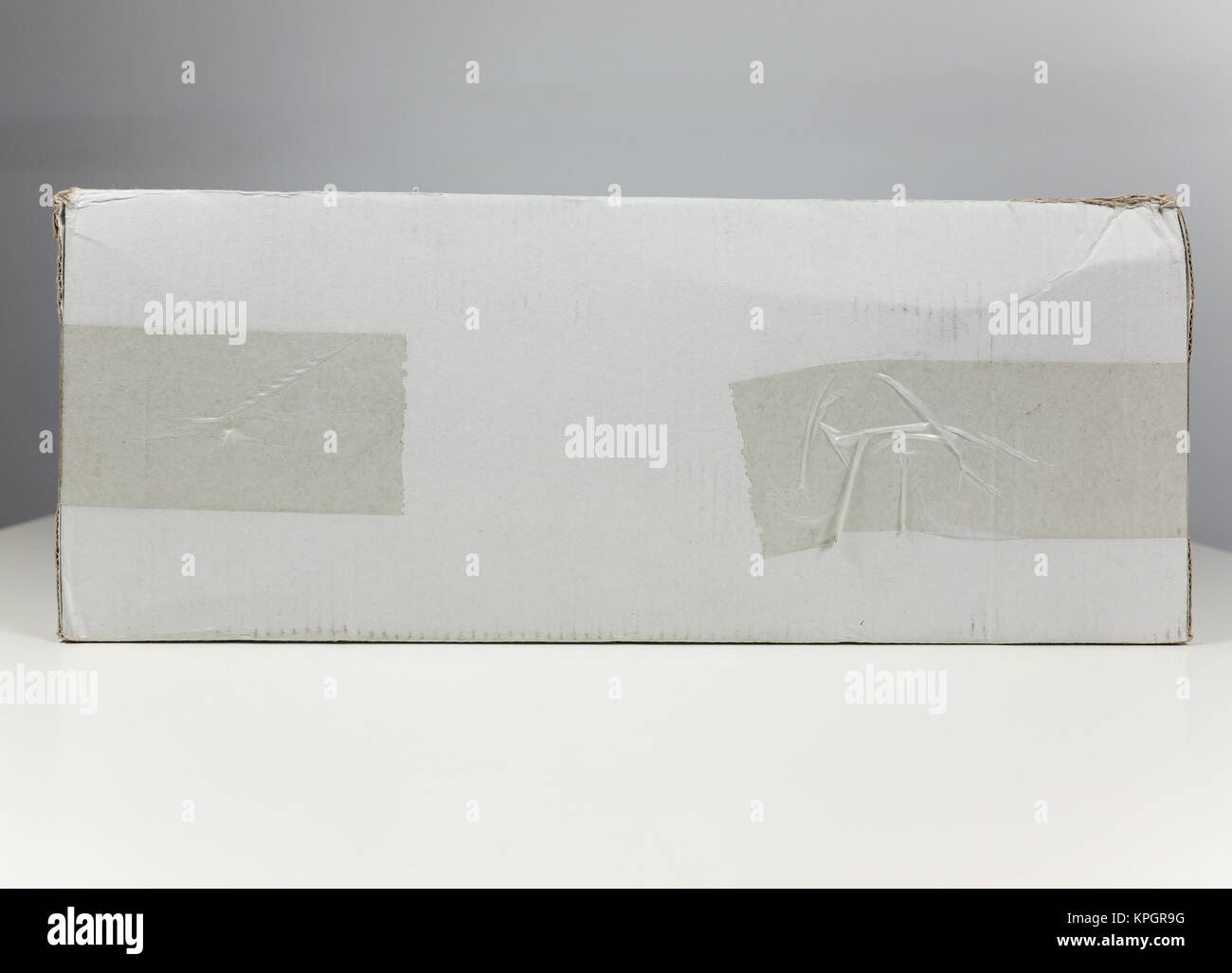 White packet parcel Stock Photo - Alamy