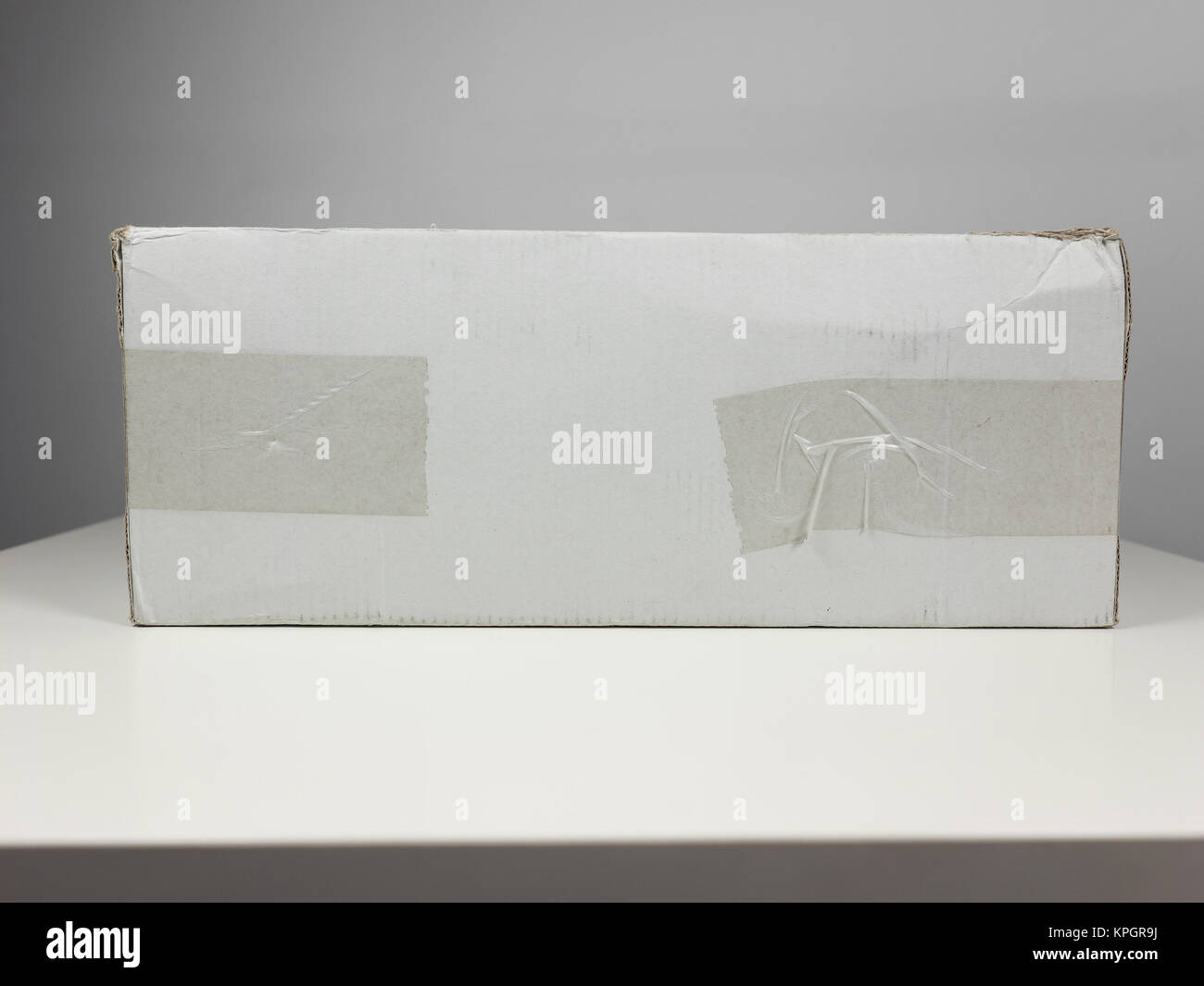 White packet parcel Stock Photo - Alamy