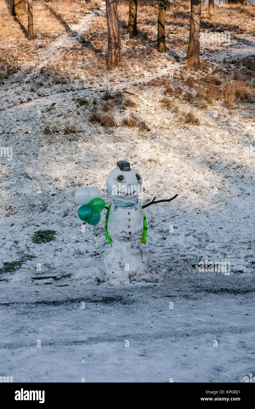 Snowman in high visibility vest in the Phoenix Park in Dublin on a ...