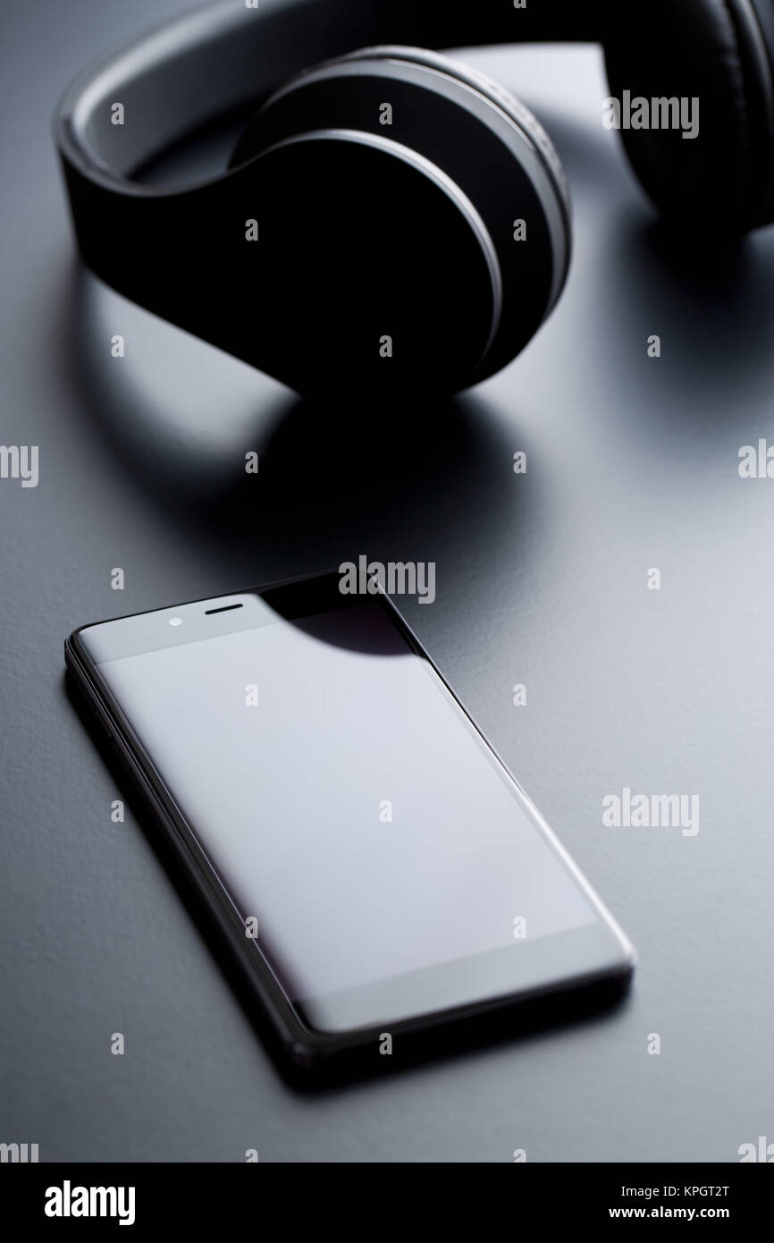 cellphone and wireless headphones Stock Photo - Alamy