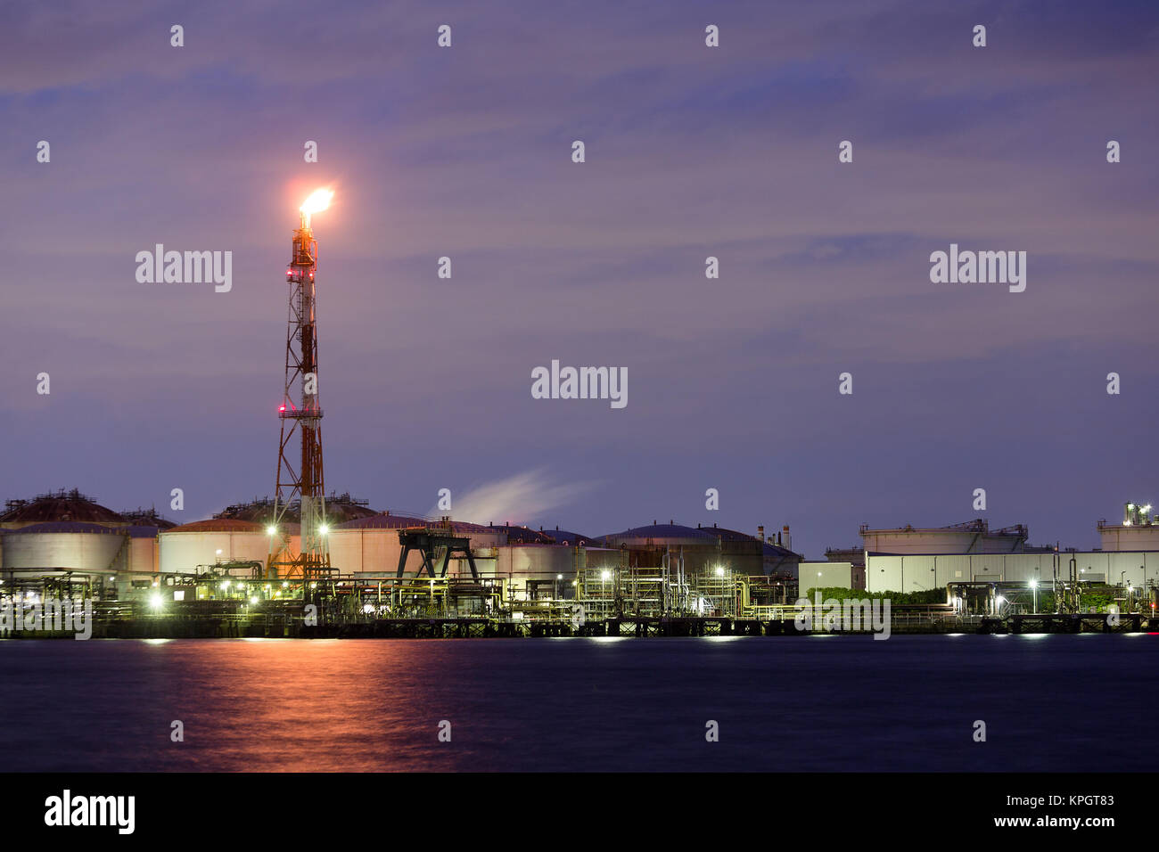 Seaside Industrial factory at night Stock Photo - Alamy