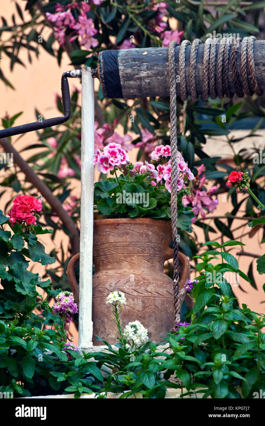 Winch and flowers, Chania, Crete, Greece Stock Photo - Alamy