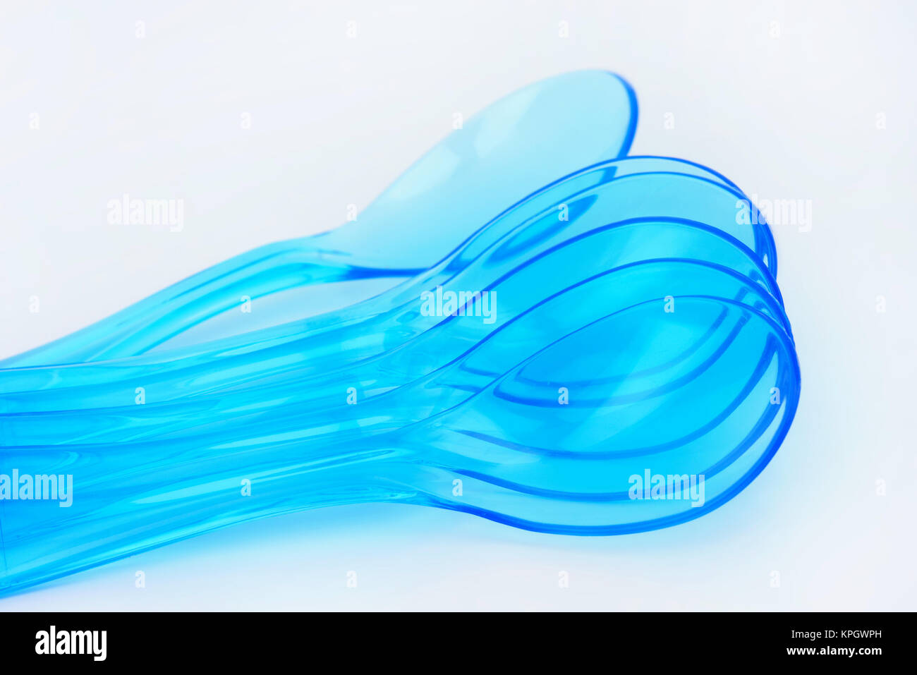 turquoise plastic spoons Stock Photo - Alamy