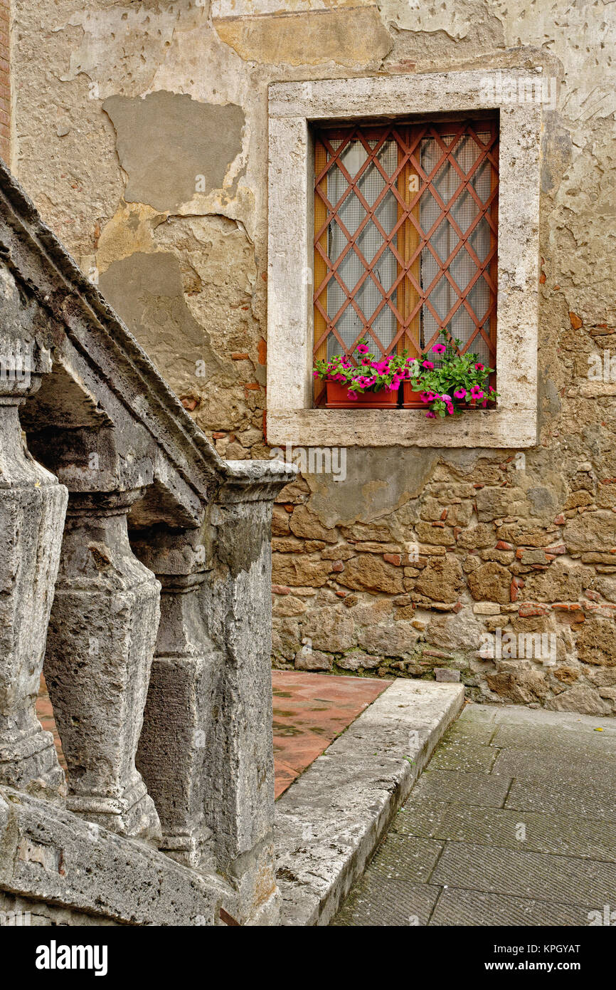 Medieval stone railing and window, Monteriggioni, in the Province of ...