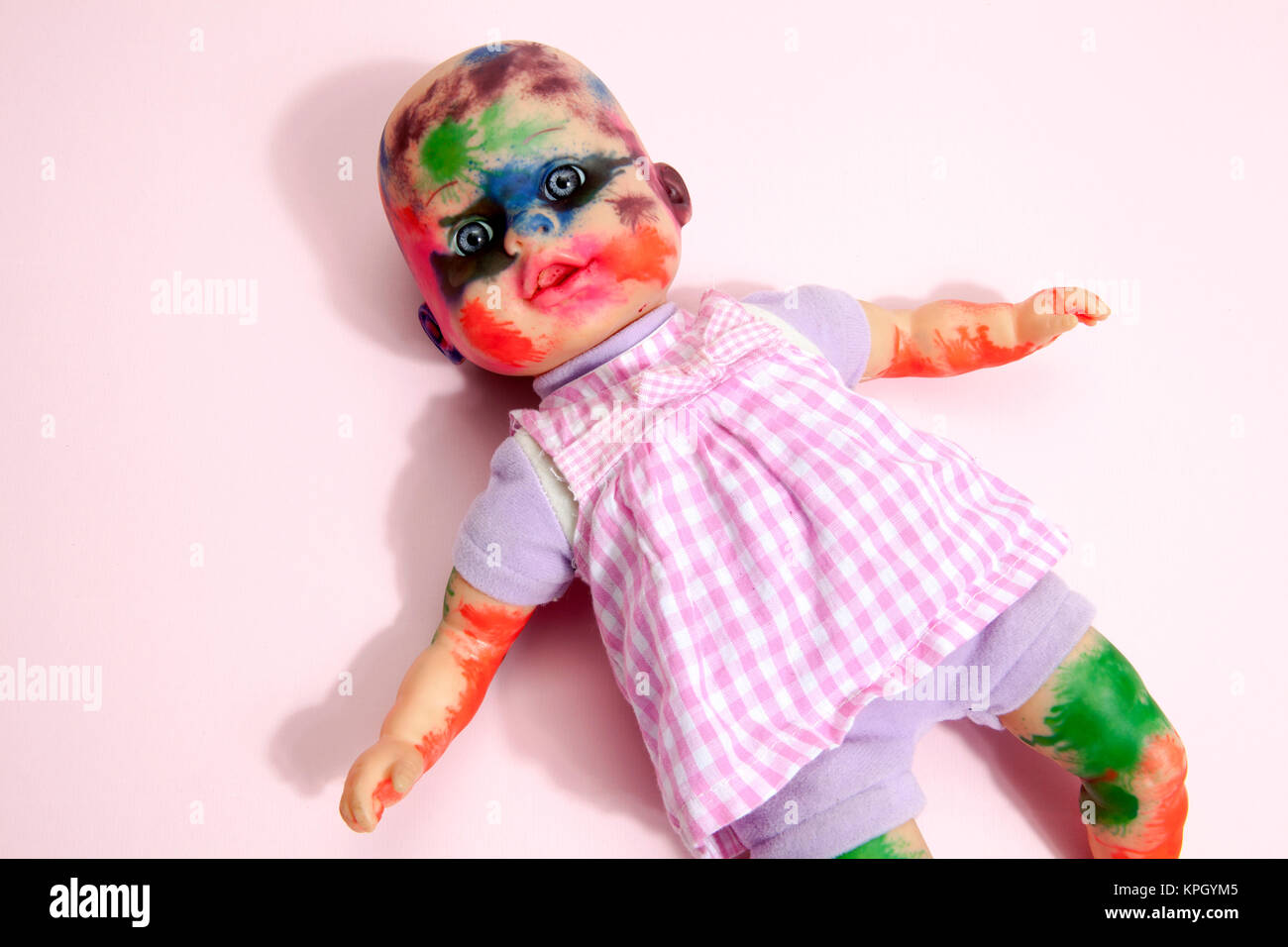 a doll transformed into a monster by the marker scribbles of a child ...