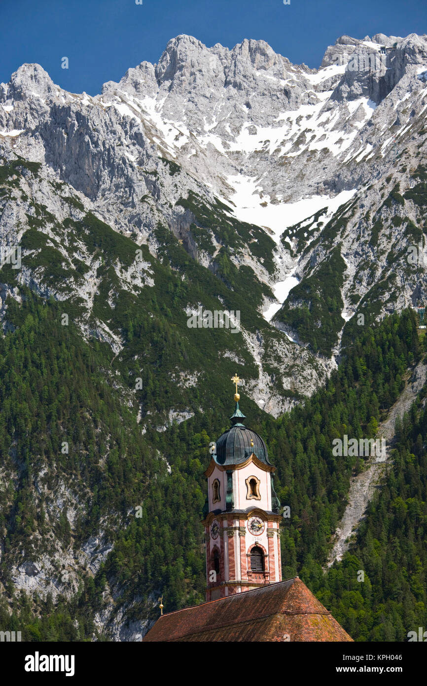 Germany, Bayern-Bavaria, Mittenwald. Town church and mountains Stock ...
