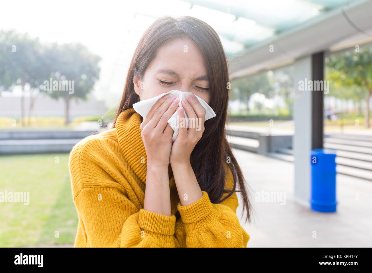 Young asian woman feeling unwell Stock Photo - Alamy