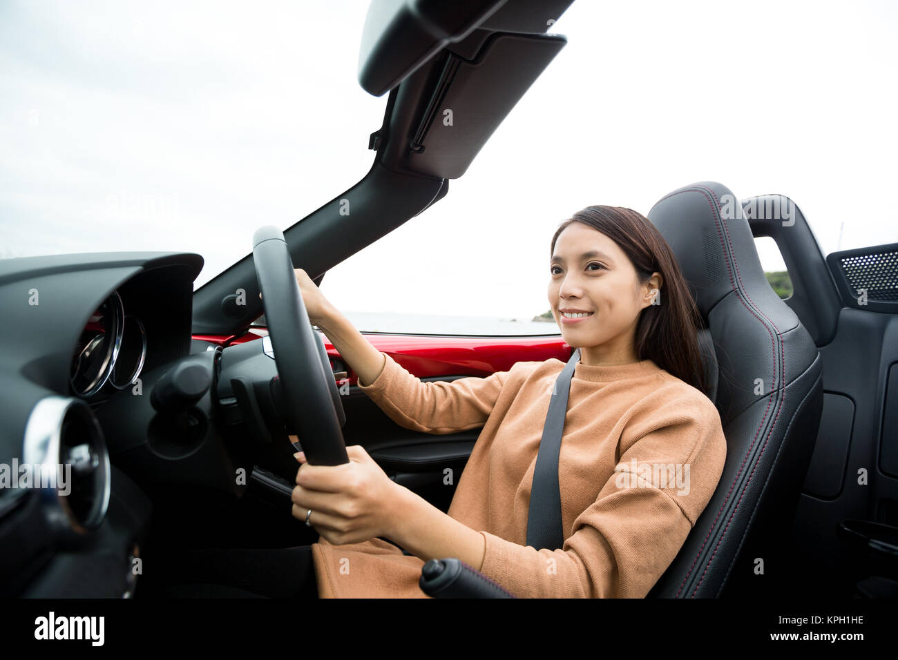 Young Woman driving convertible car Stock Photo - Alamy
