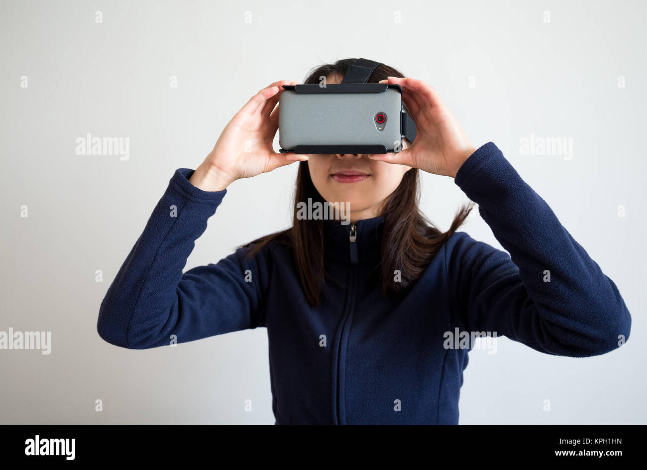 Young woman wearing VR-headset Stock Photo - Alamy