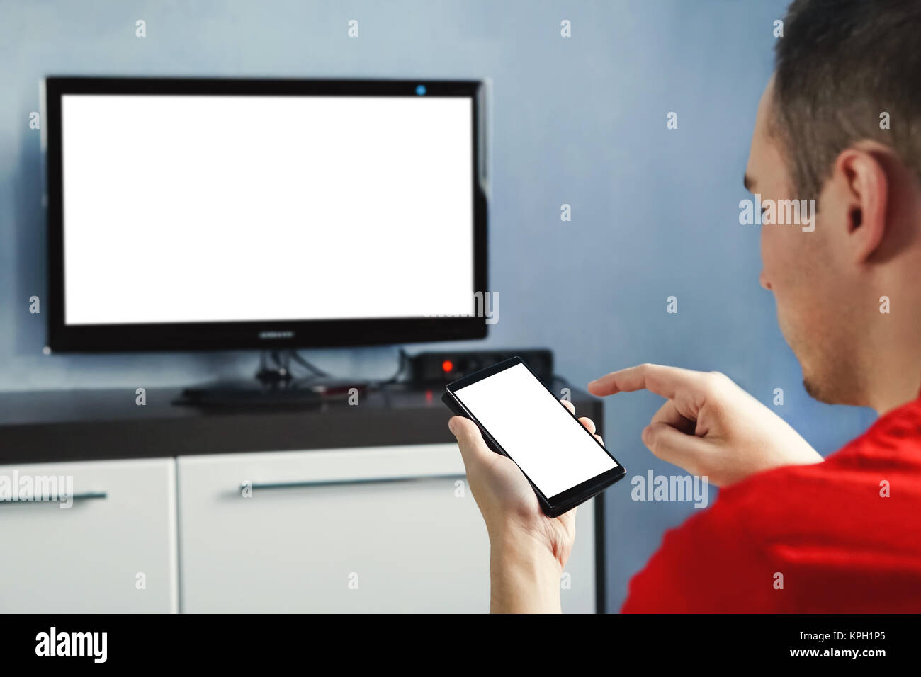Using Smartphone Watching Tv High Resolution Stock Photography and ...