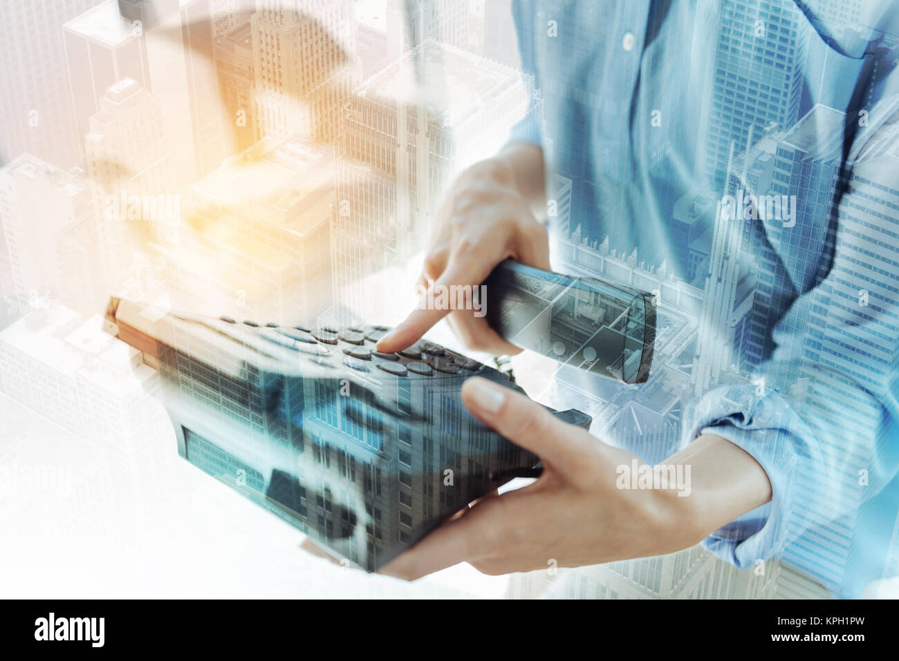 Young busy woman keeping the phone and dialing Stock Photo - Alamy