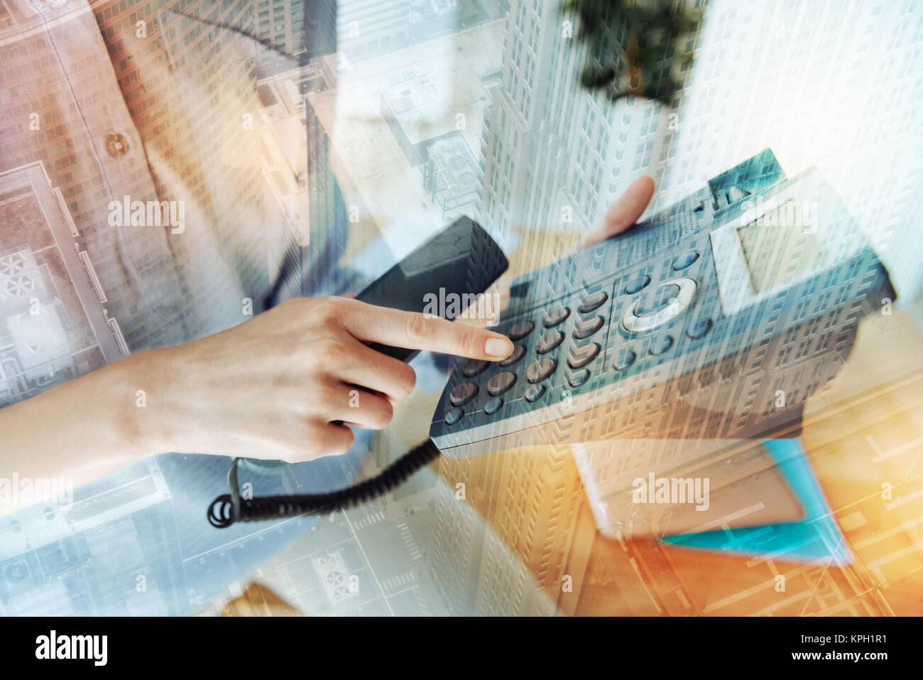 Smart busy woman standing and dialing Stock Photo - Alamy